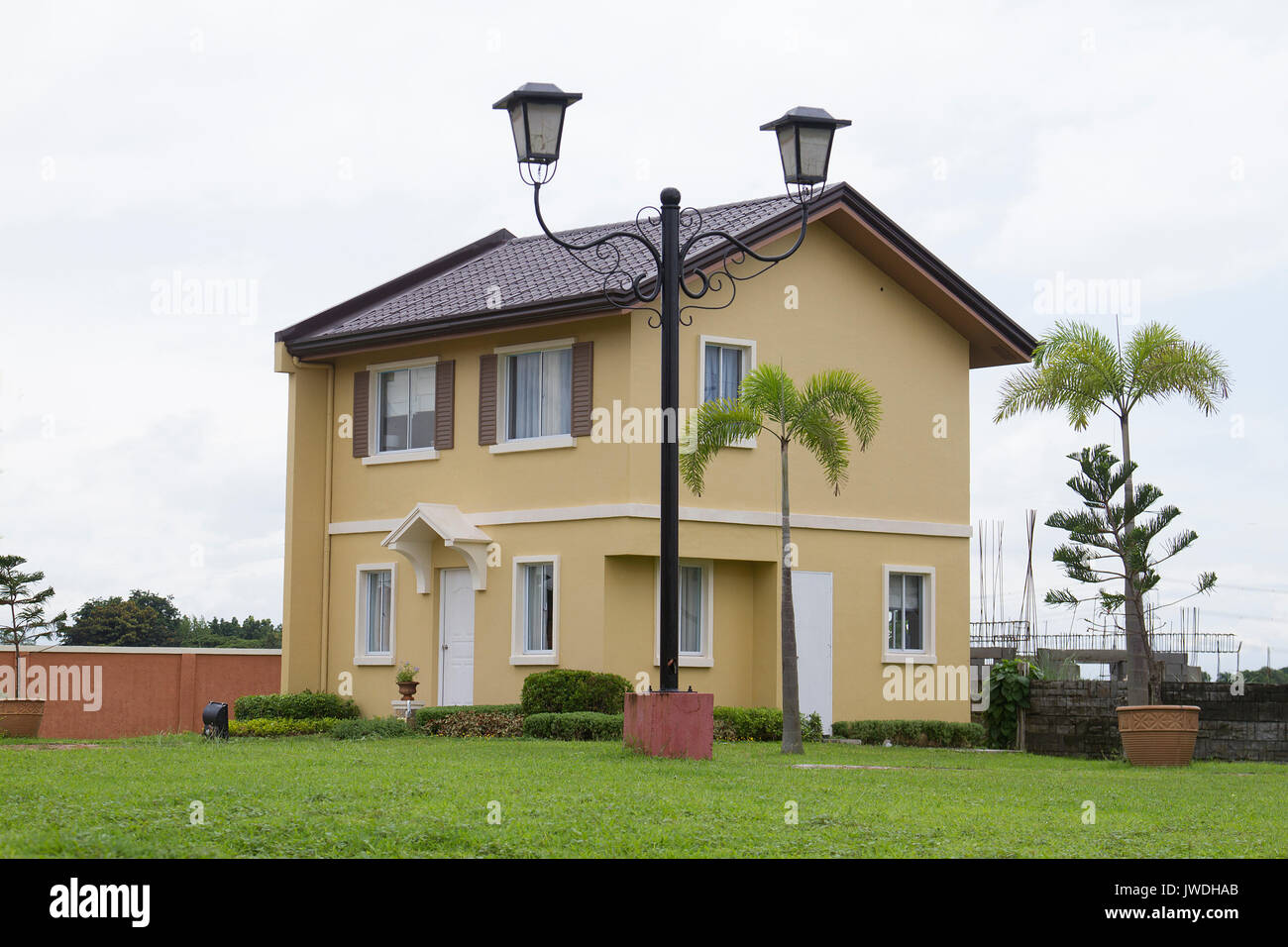 Detached single two story house with a beautiful landscape Stock Photo ...