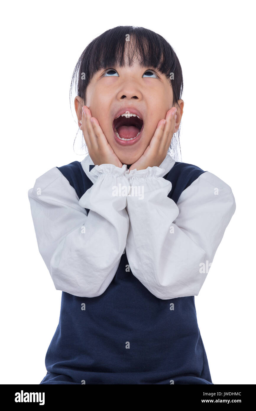Asian Little Chinese Girl screaming with hands on her face in isolated ...