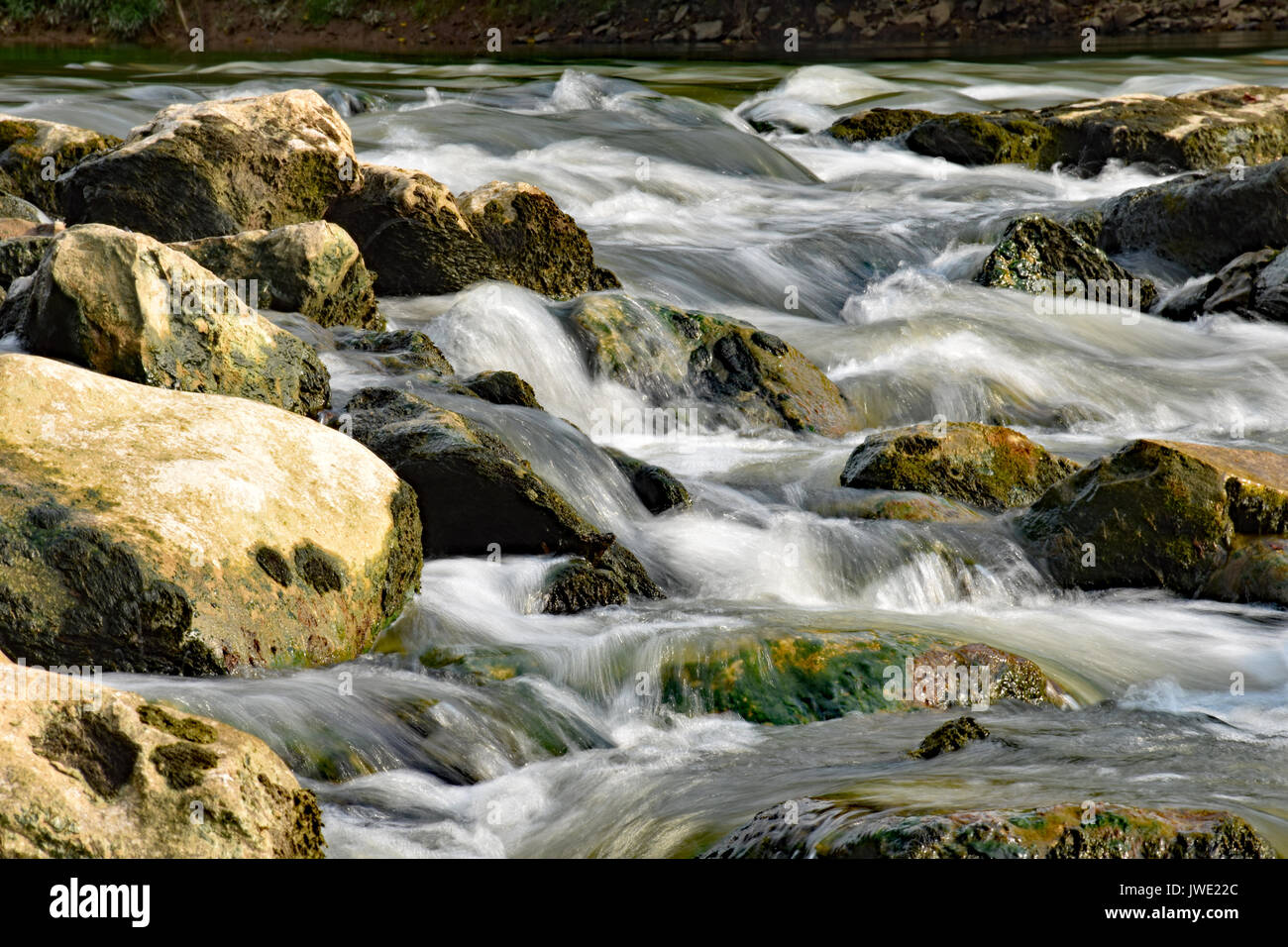 River Flowing Over Rocks Stock Photo - Alamy
