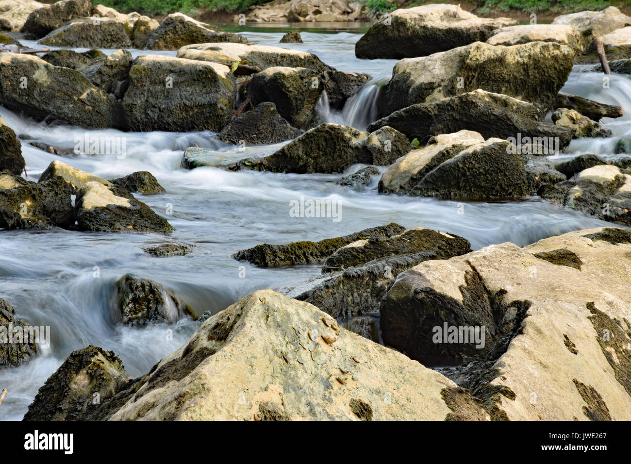 River Flowing Over Rocks Stock Photo - Alamy