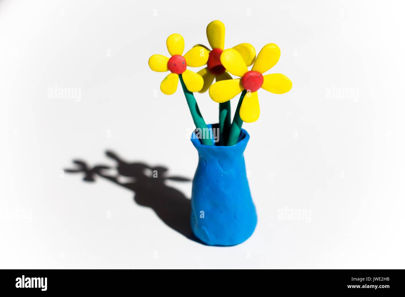 The blue vase is made of plasticine with three colors of different ...