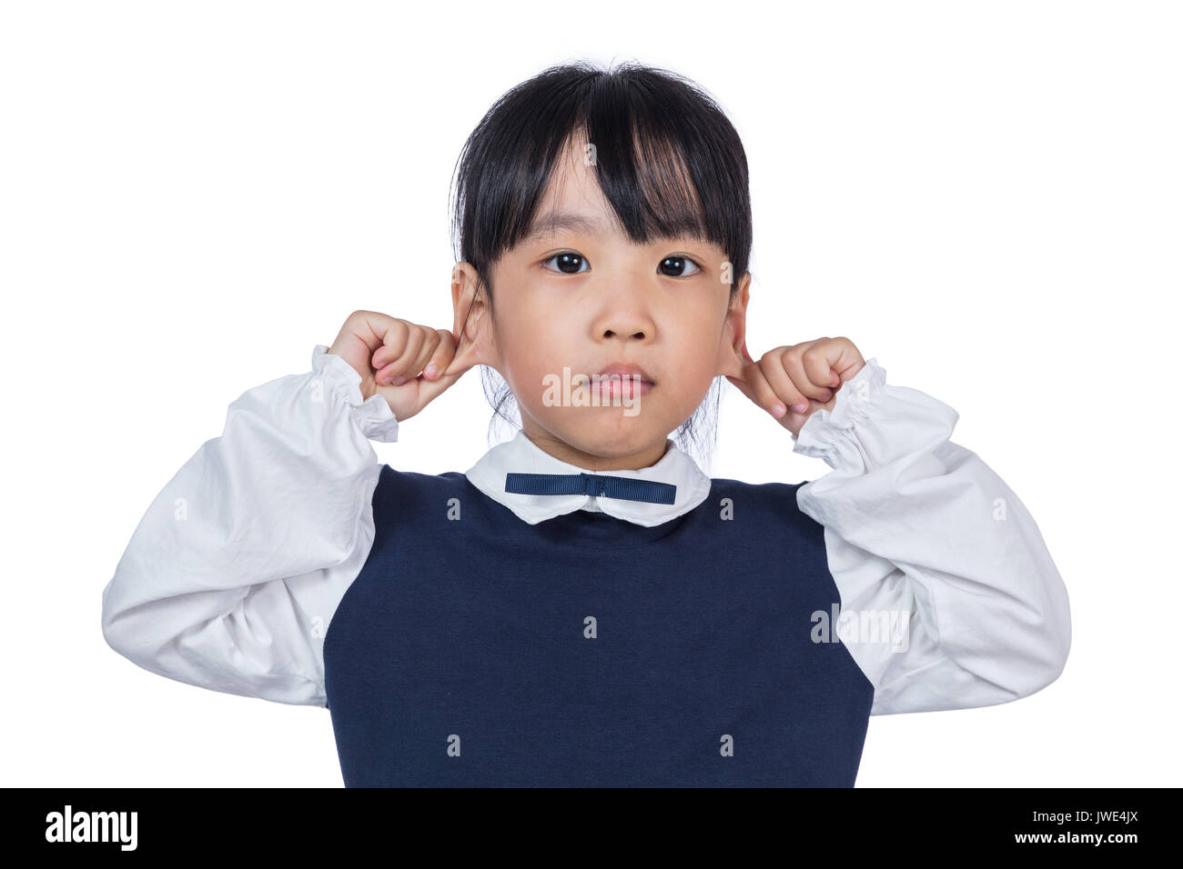 Asian Little Chinese Girl pulling her ears in isolated White Background ...