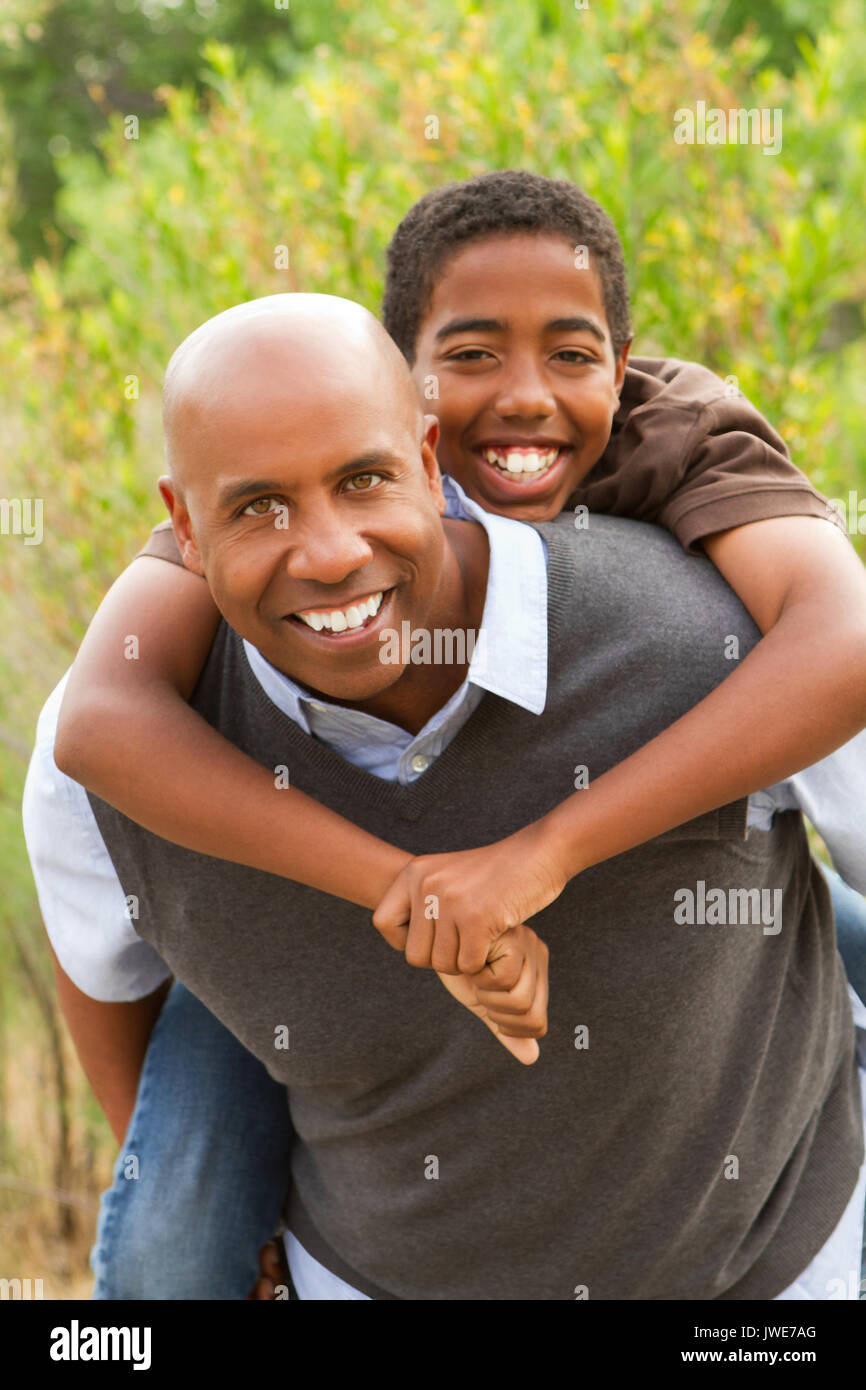 African American father and son talking and laughing Stock Photo - Alamy