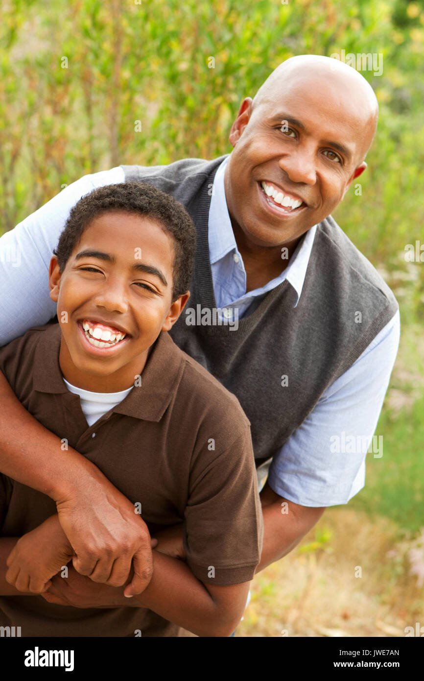 African American father and son talking and laughing Stock Photo - Alamy