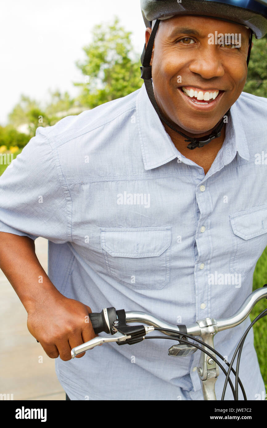 African American man riding a bike Stock Photo - Alamy
