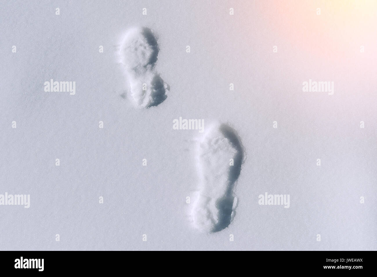 Footprints in snow Stock Photo - Alamy