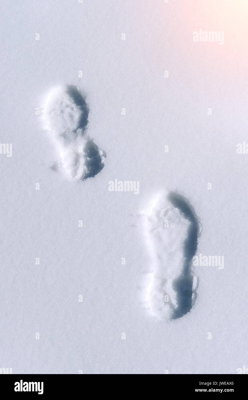 Footprints in snow Stock Photo - Alamy