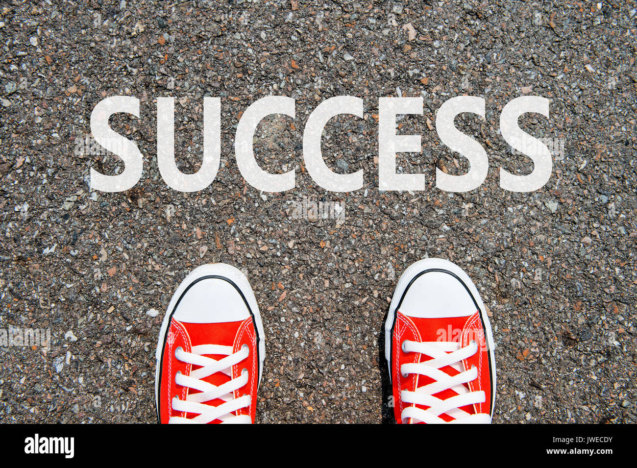 Feet concept with red sneakers on black background with success text ...