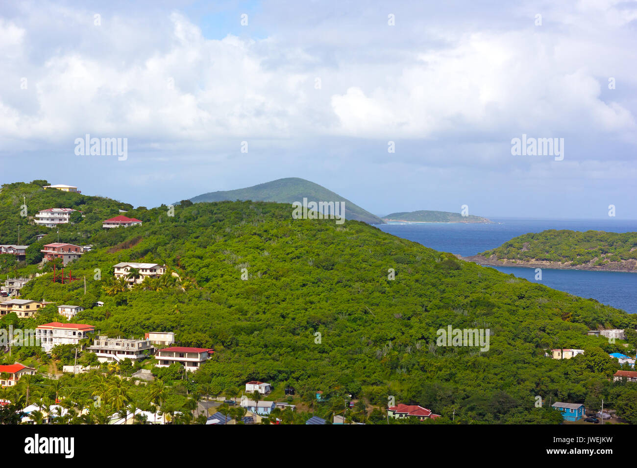 Landscape of St Thomas Island with houses, mountains and distant ...