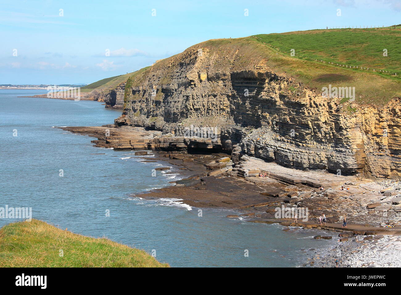 The enormouse rocky cliffs at Southerndown on a sunny day demonstrates ...