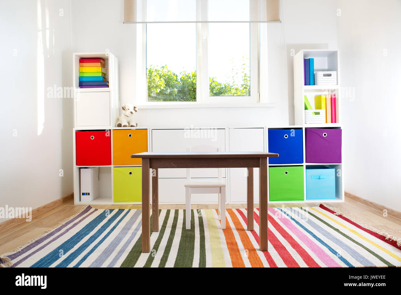 Colourful children rooom with white walls and furniture Stock Photo - Alamy