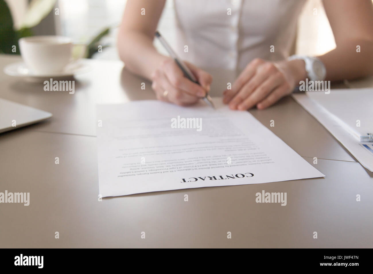 Businesswoman signing document, female hands putting signature Stock ...
