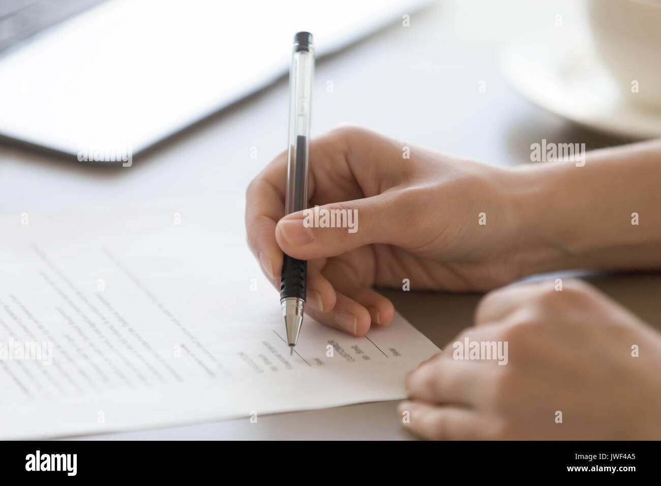 Female hand putting signature on document, signing official pape Stock ...
