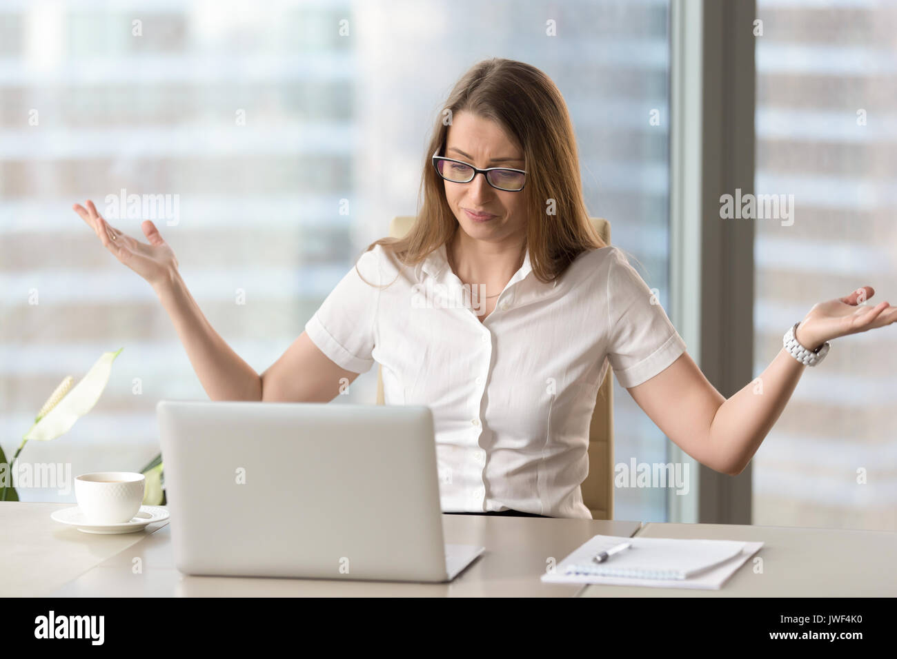 Stressed businesswoman at desk hi-res stock photography and images - Alamy