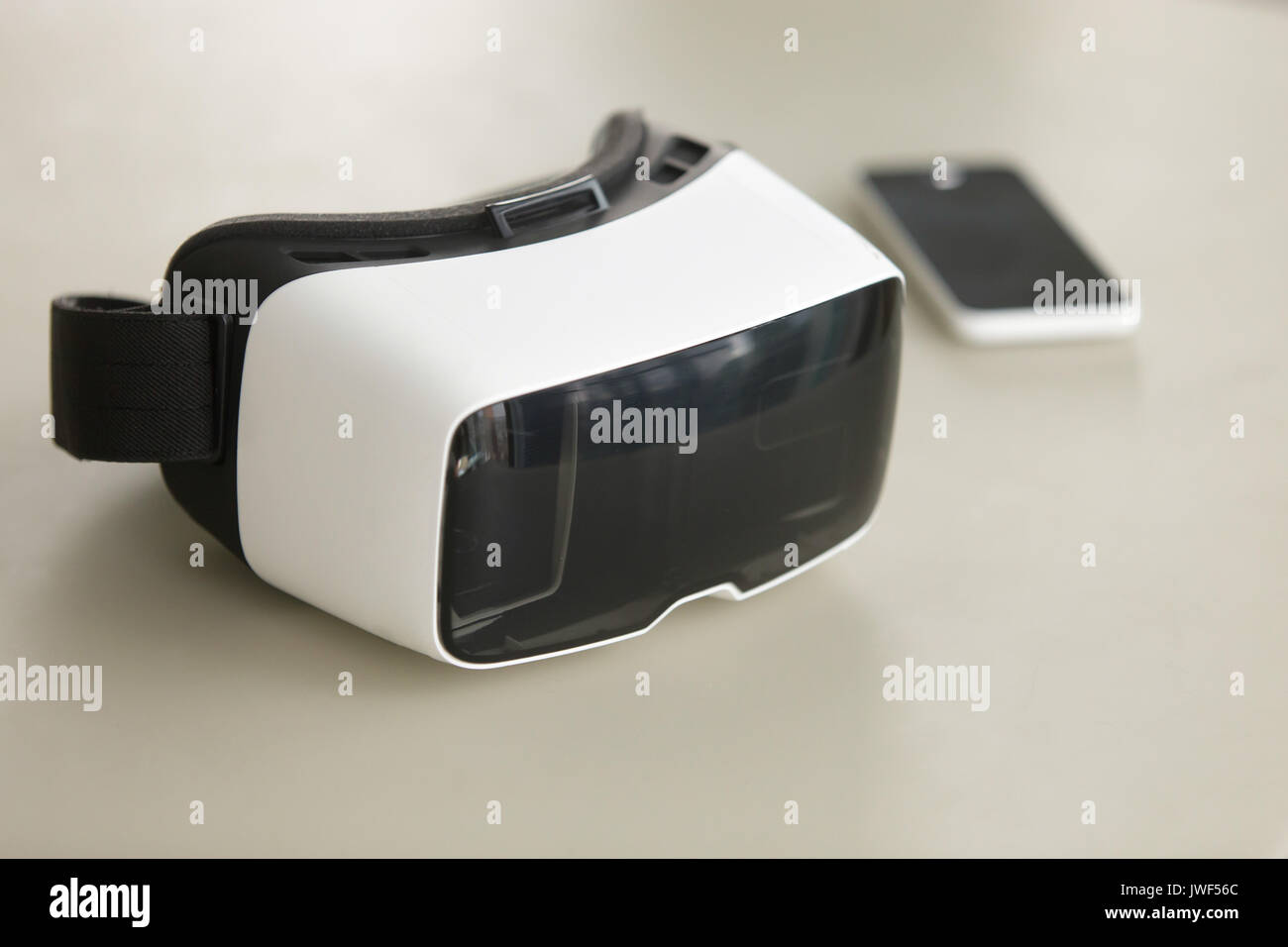 VR headset and smartphone on desk, virtual reality mobile techno Stock ...