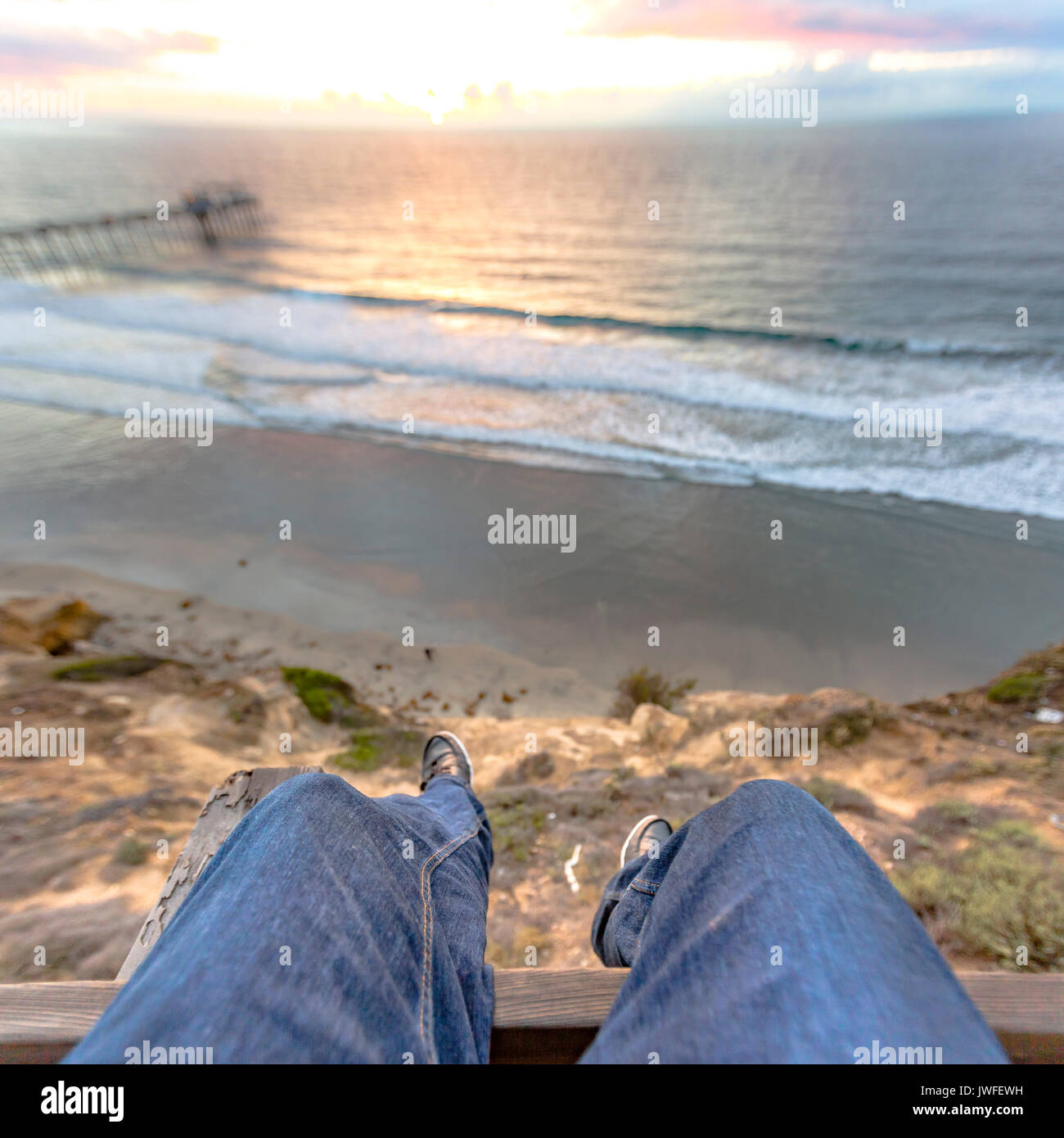 Feet hanging off pier hi-res stock photography and images - Alamy