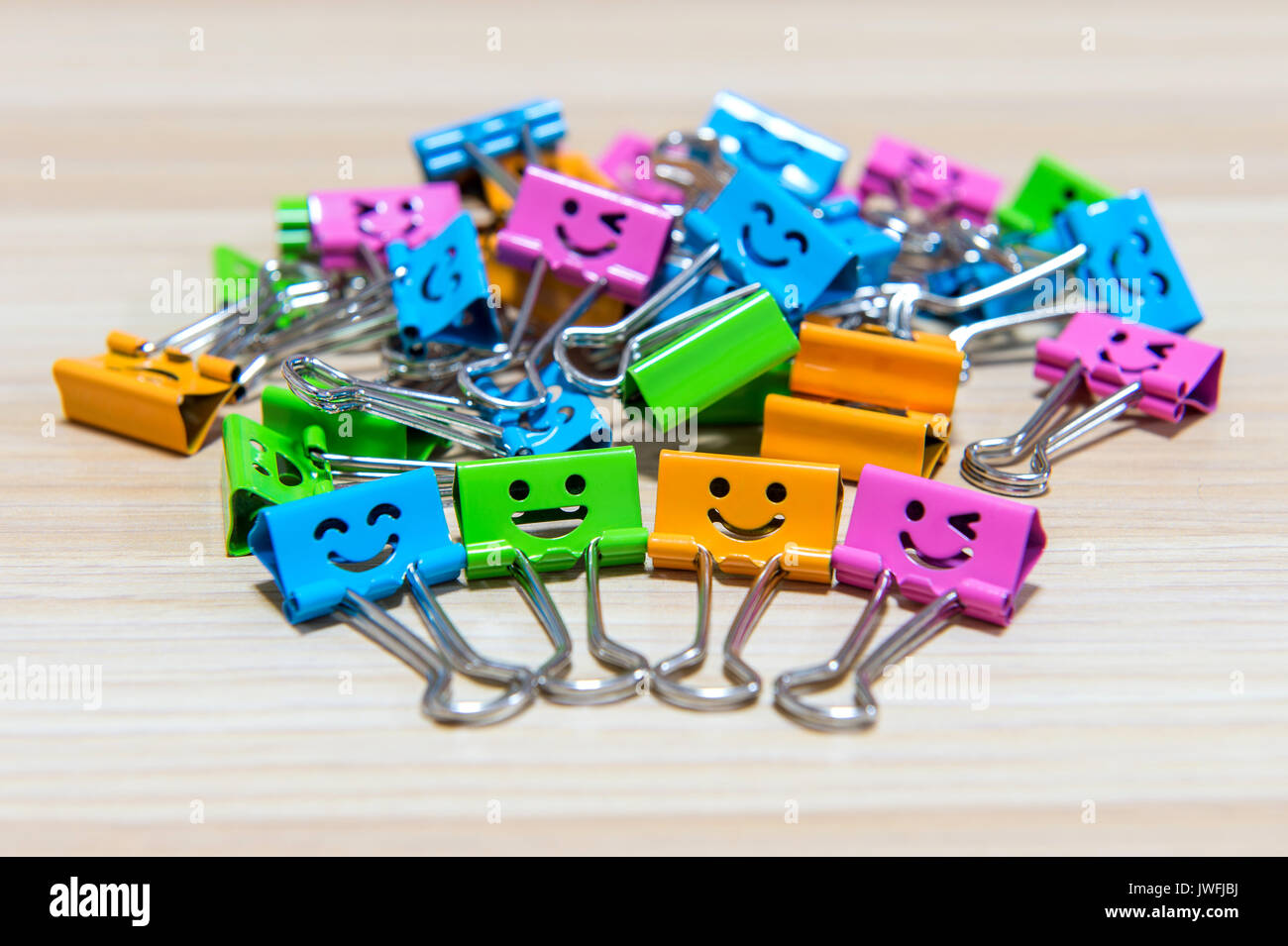 Colorful paper clips. Smile paper clips Stock Photo - Alamy