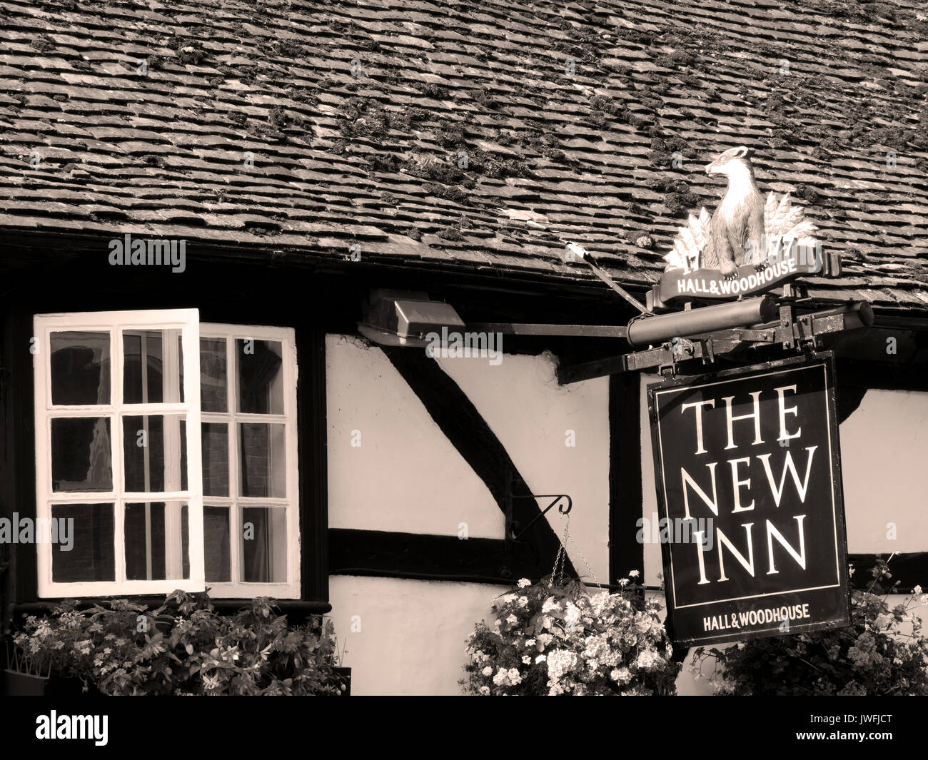 The New Inn public house and hotel sign above premises, building dates ...