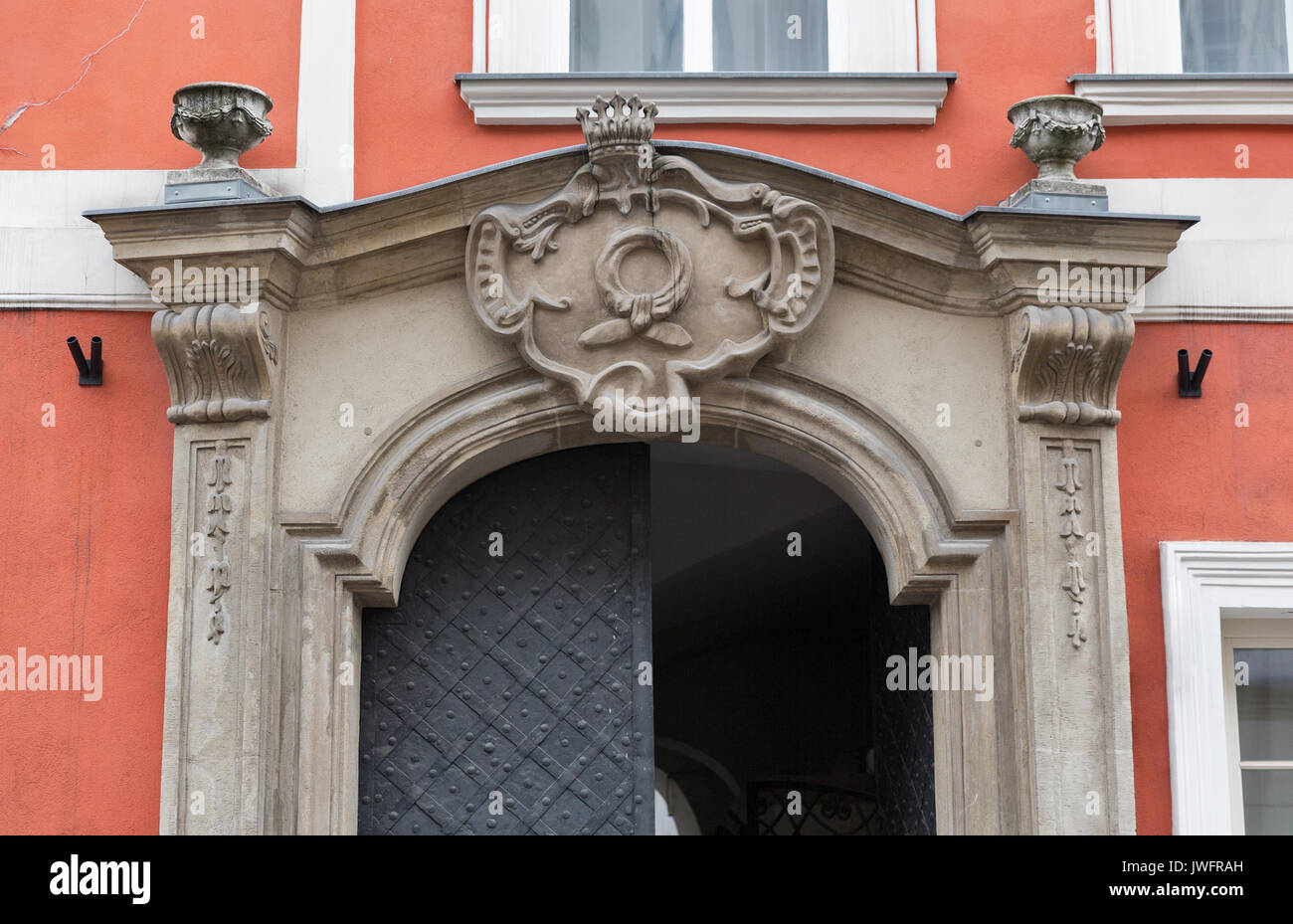 Ancient stone Coat of Arms with crone closeup above house entrance in ...