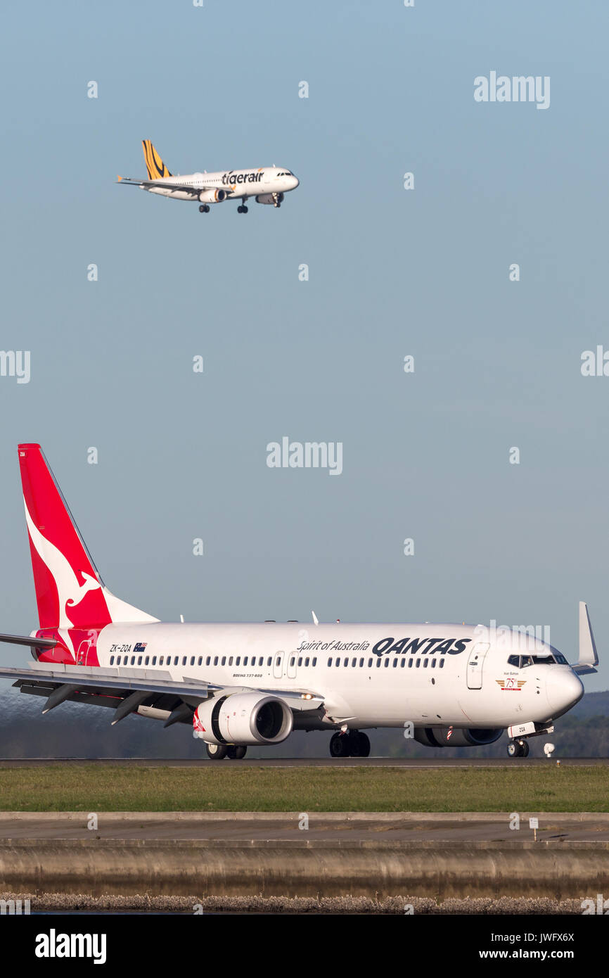 Qantas Boeing 737-800 aircraft at Sydney Airport with a Tiger Airways ...