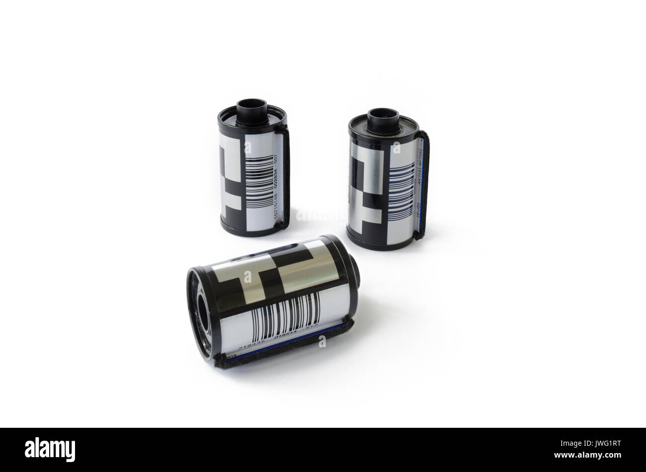 Three old 35mm film cartridges isolated on a white background Stock ...