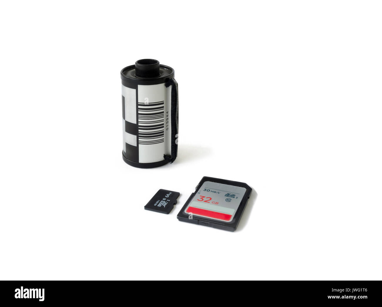Old 35mm film cartridge, micro sd and sd card isolated on a white ...