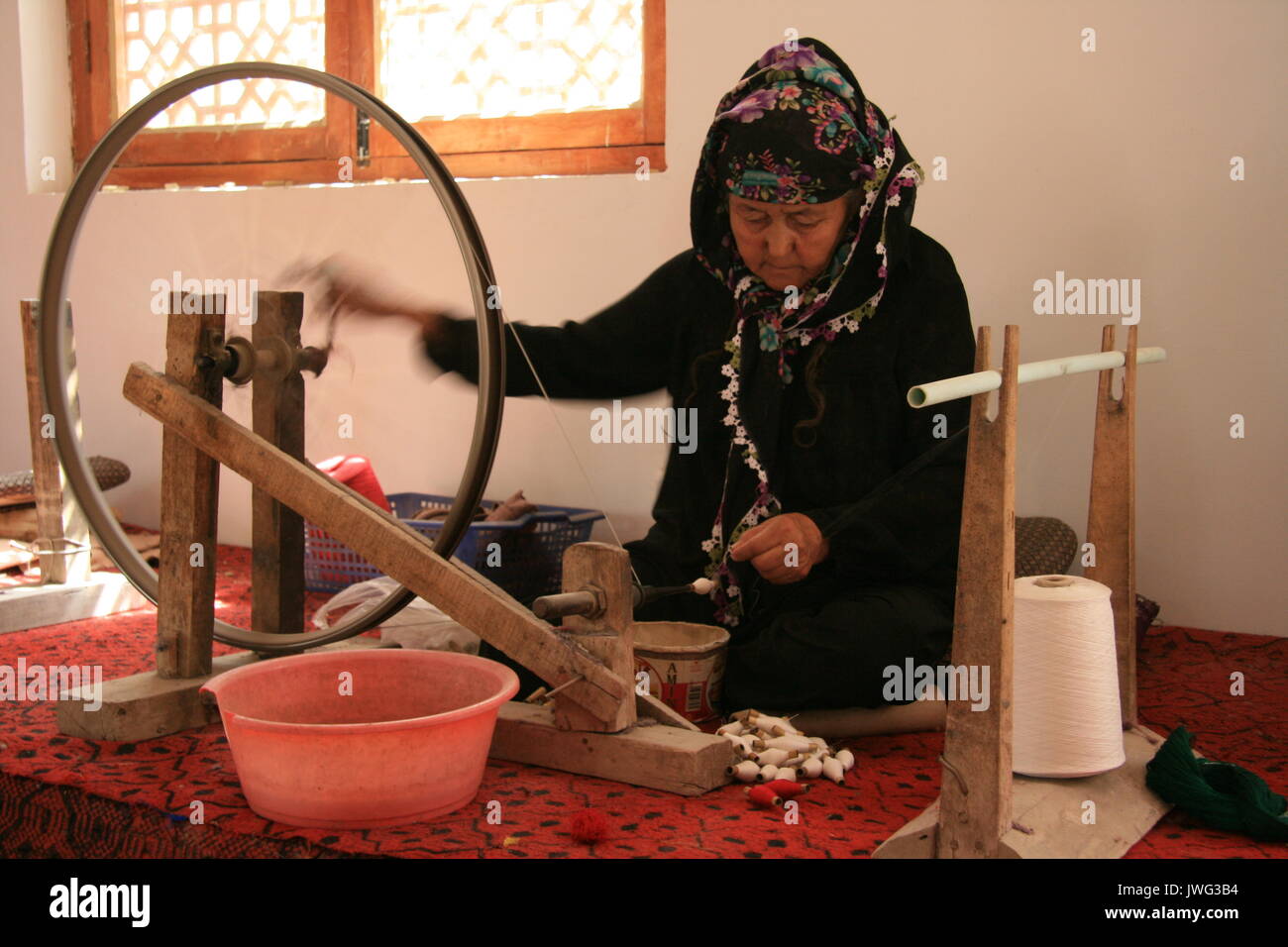 Lady polishing and finishing a jade engraving in a Hotal factory Stock ...