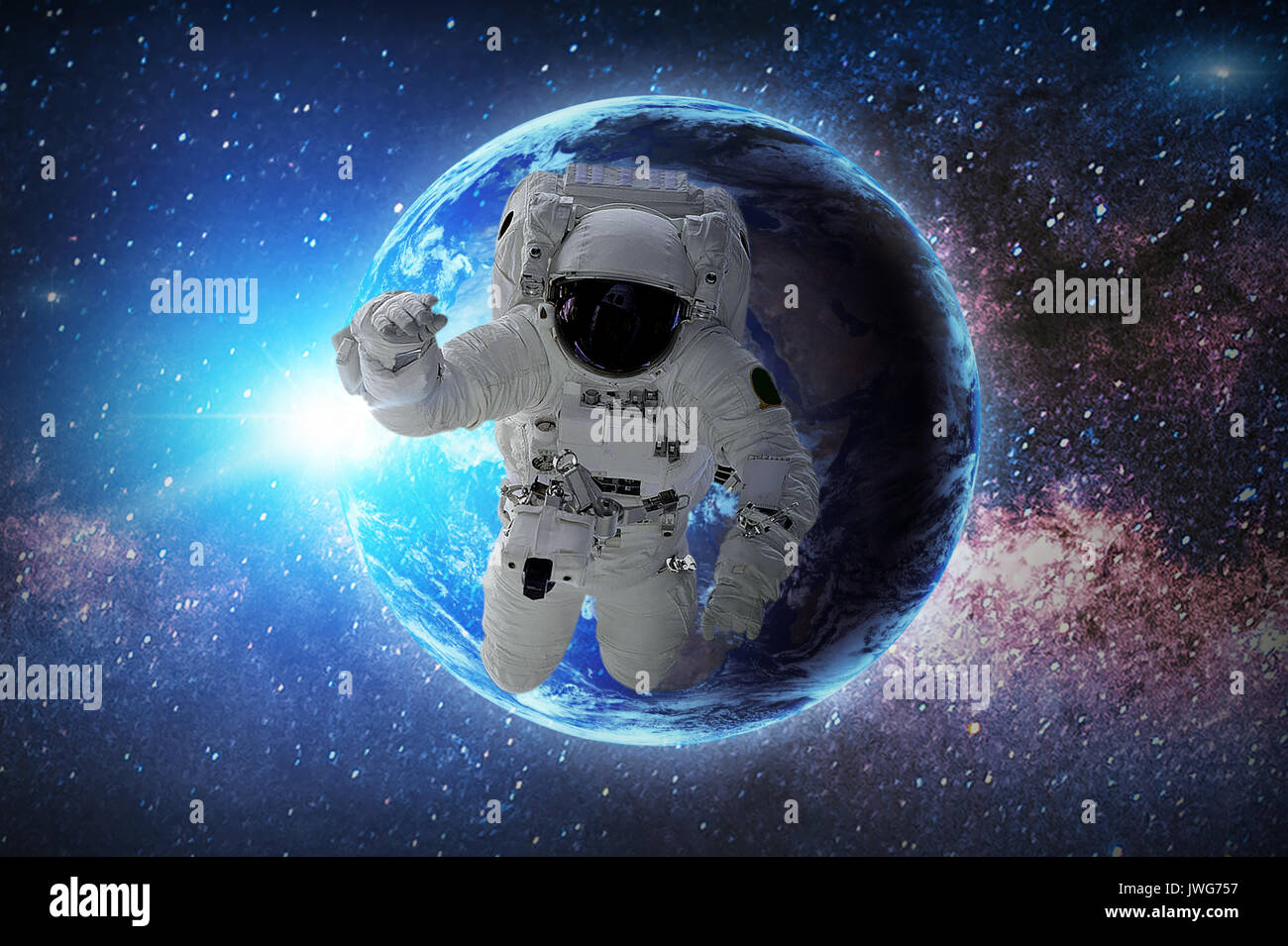 Astronaut in galaxy. Elements of this image furnished by NASA Stock ...