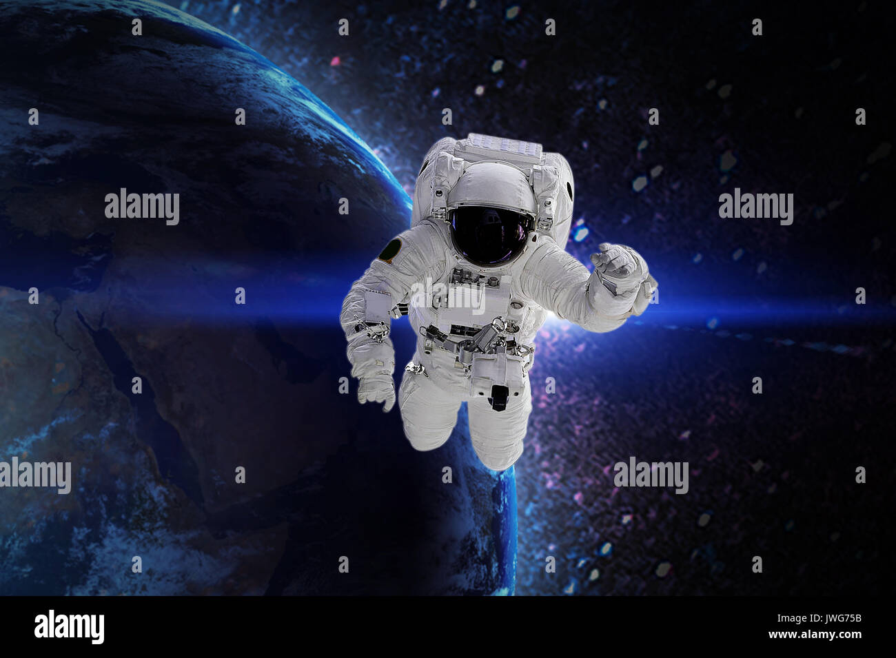 Astronaut in galaxy. Elements of this image furnished by NASA Stock ...