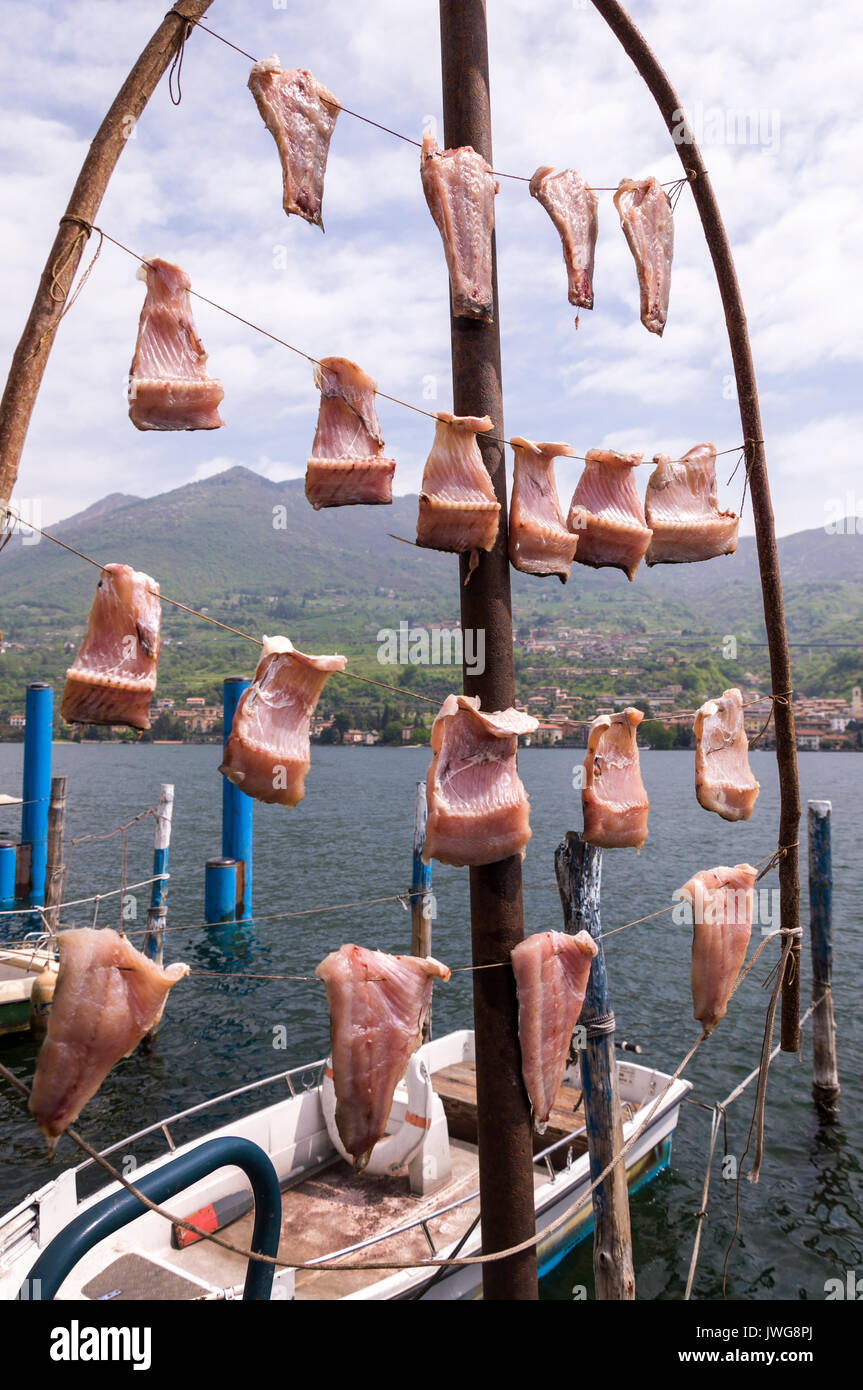 Fish hanging on rack to dry at Peschiera Maraglio, Monte Isola, Lake ...