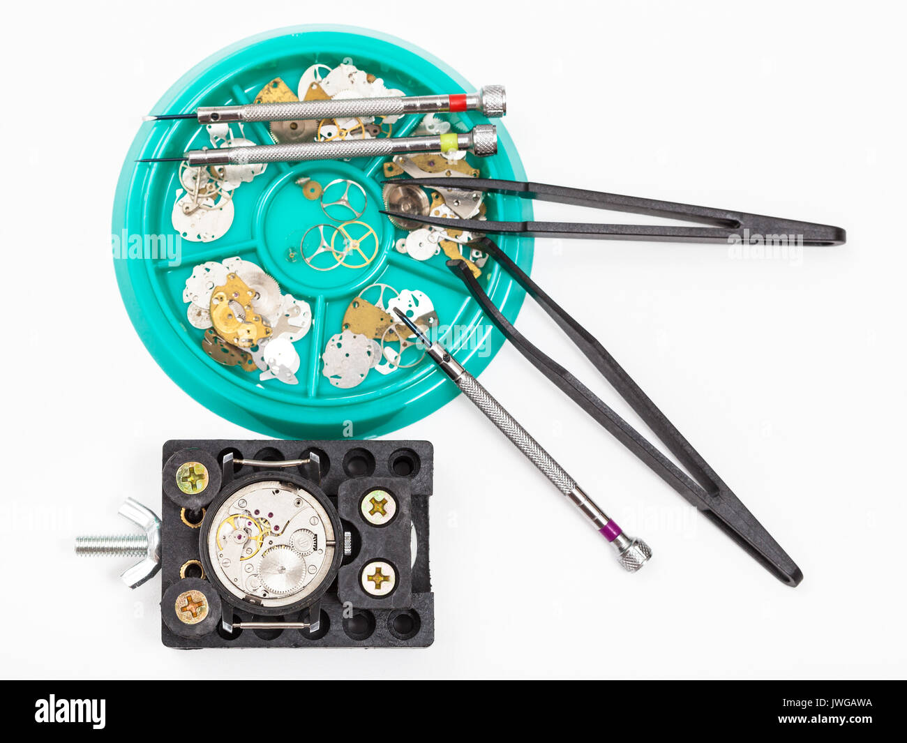 watchmaker workshop - top view of tools and spare parts for repairing ...
