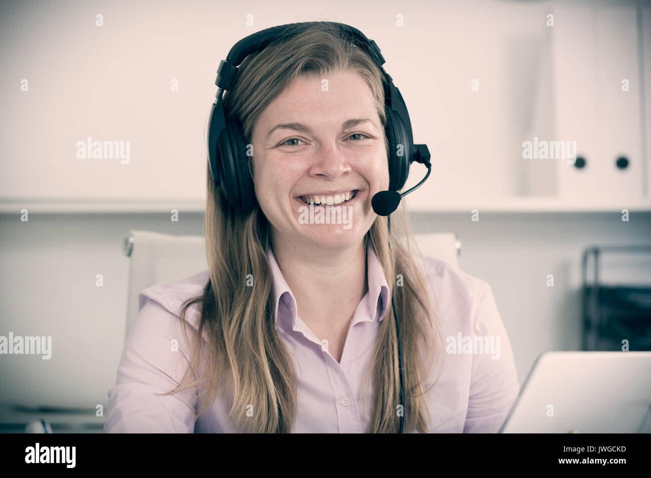 Female employee having a productive day at call-center Stock Photo - Alamy