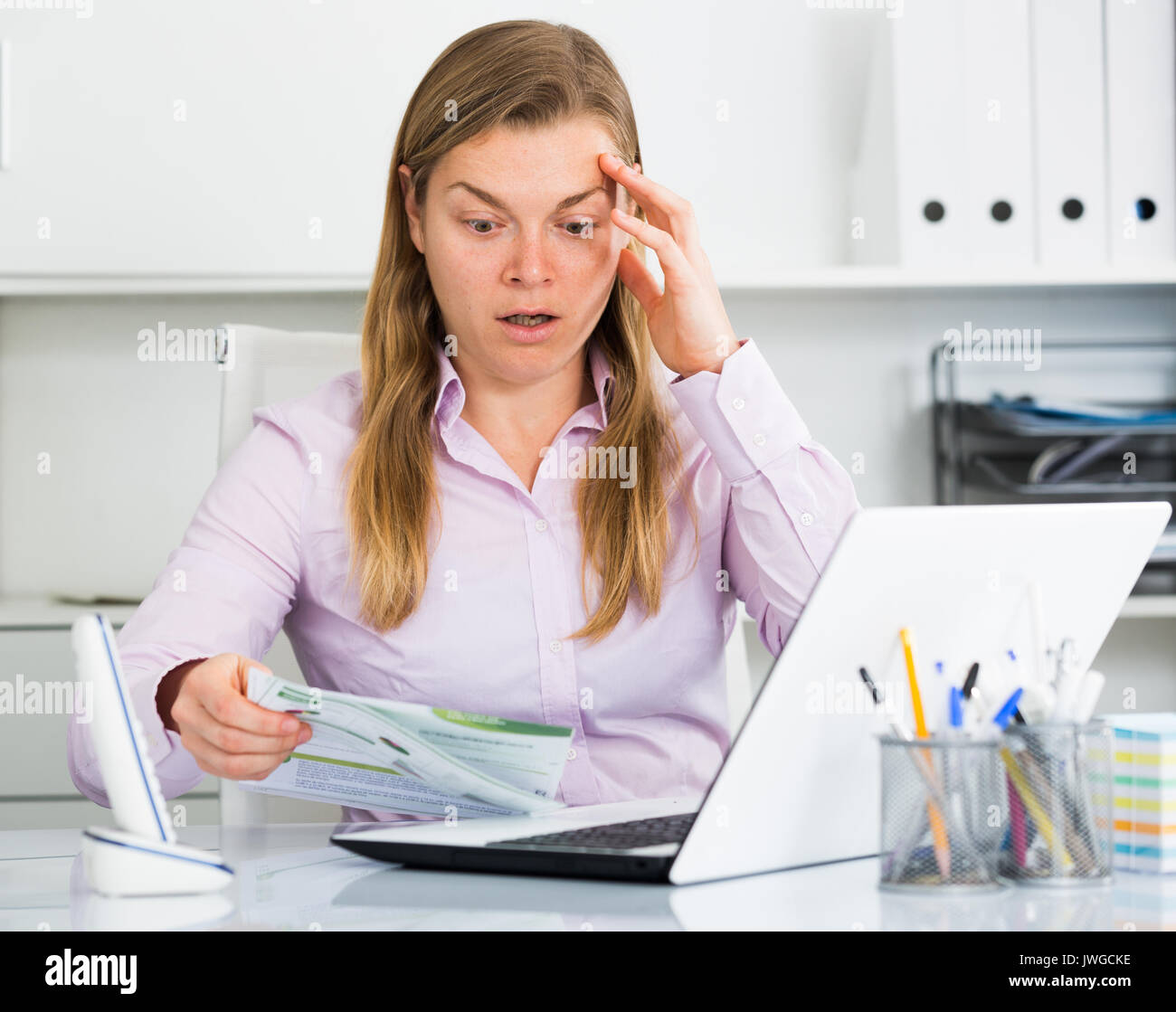 Female employee having complicated issue in project in office Stock ...