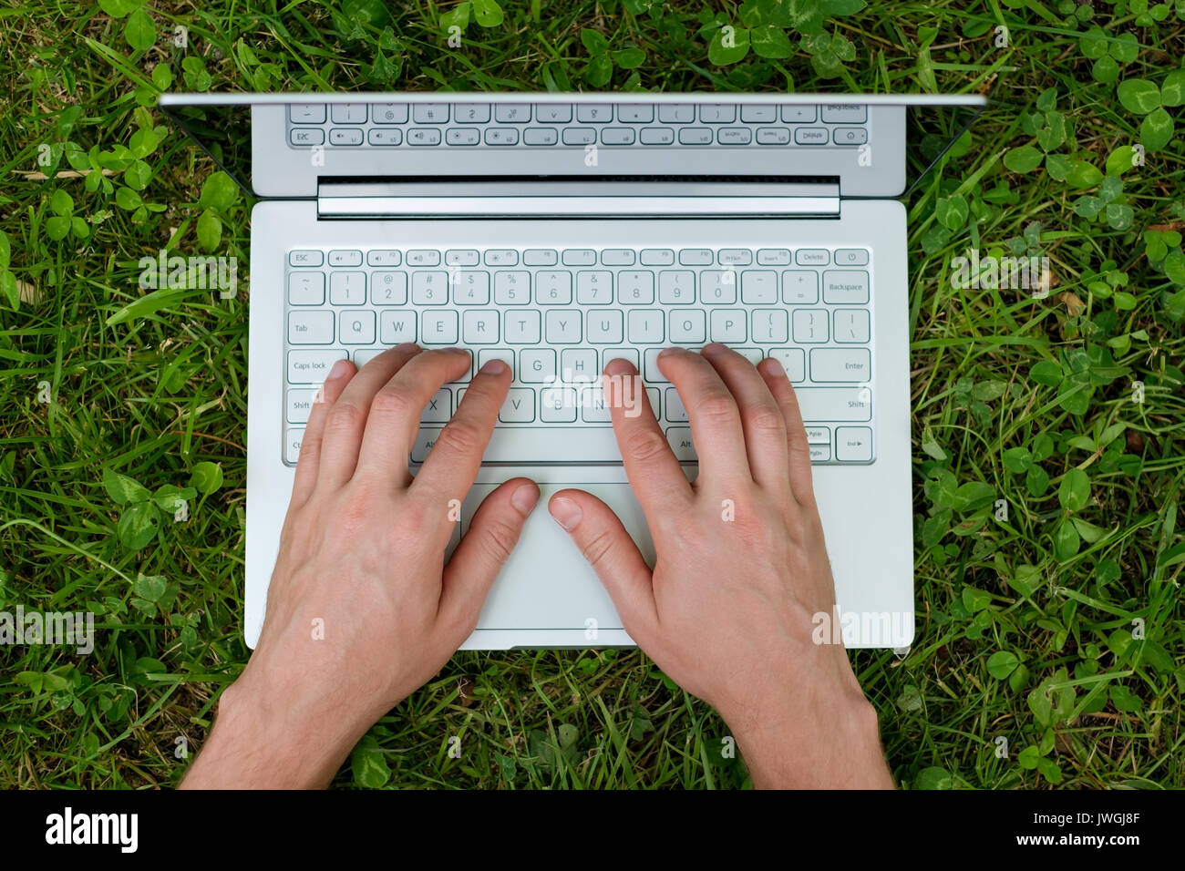 Hand typing on laptop hi-res stock photography and images - Alamy