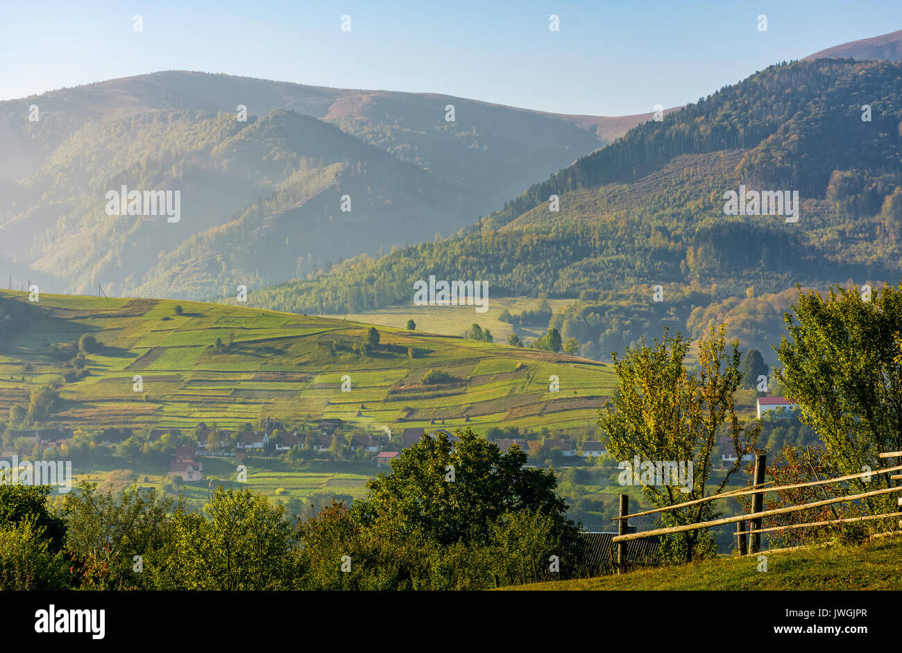 beautiful rural area in mountainous countryside. fence on hillside ...
