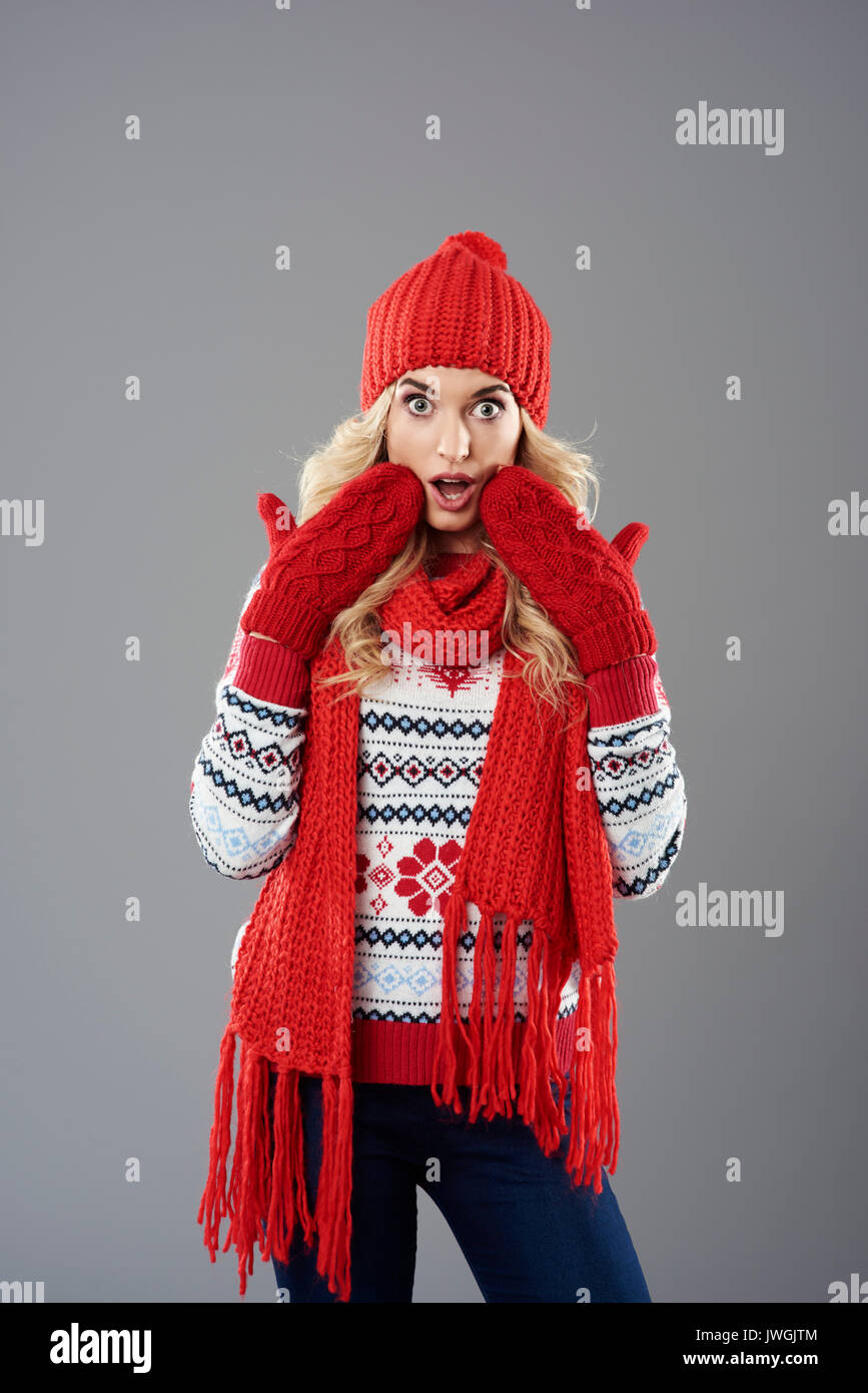 Shocked woman wearing set of winter clothing Stock Photo - Alamy