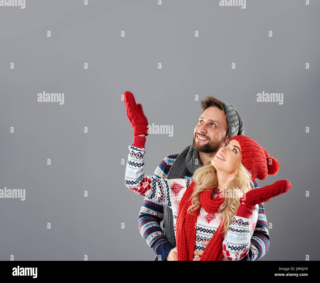 Couple looking how the snow is falling Stock Photo - Alamy