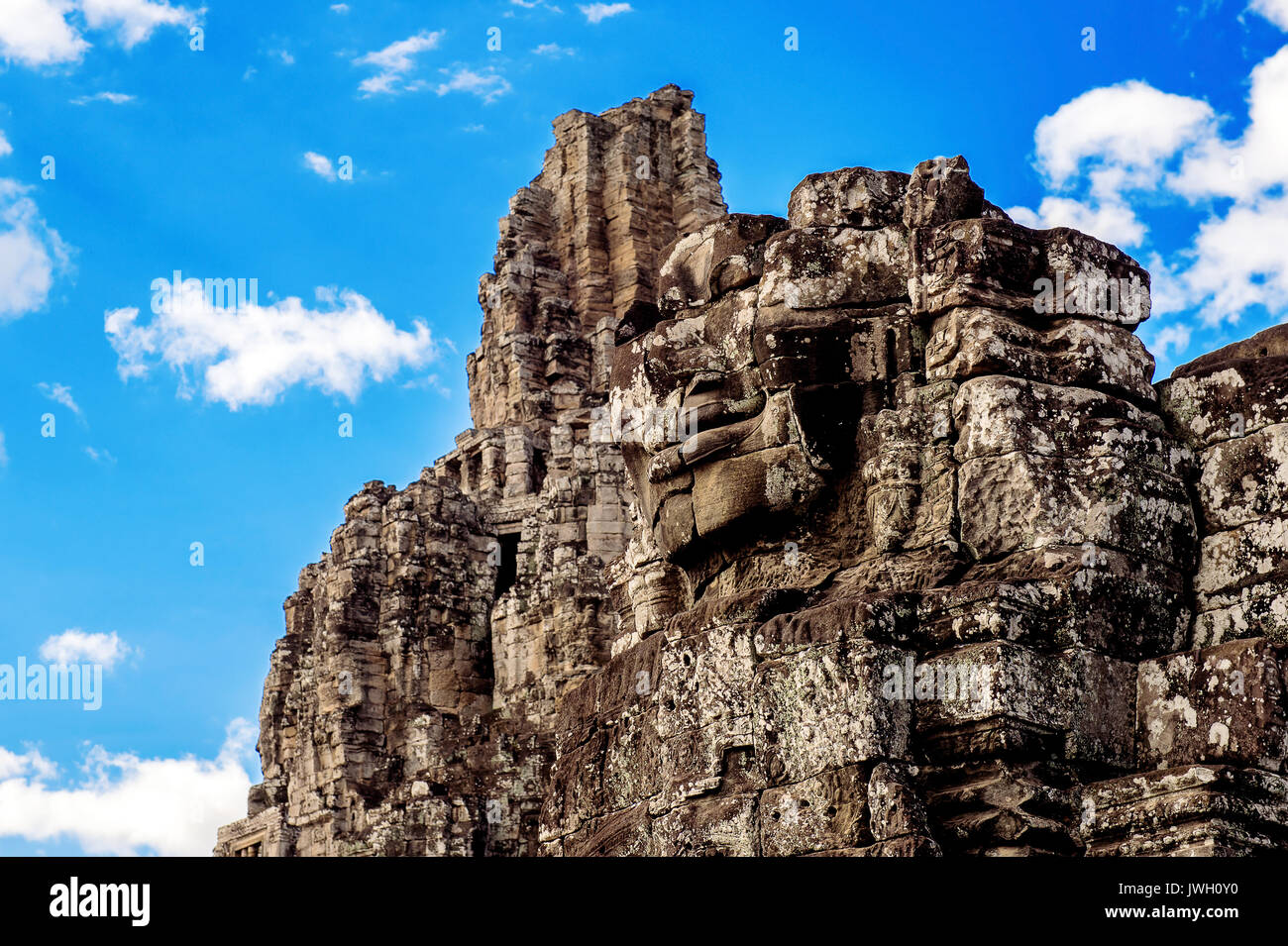 Ancient stone faces of Bayon temple, Angkor Wat, Siam Reap, Cambodia ...