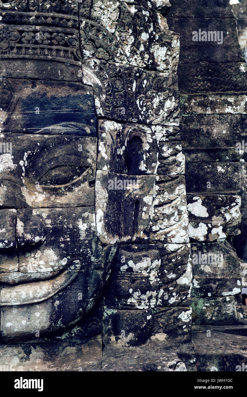 Ancient stone faces of Bayon temple, Angkor Wat, Siam Reap, Cambodia ...