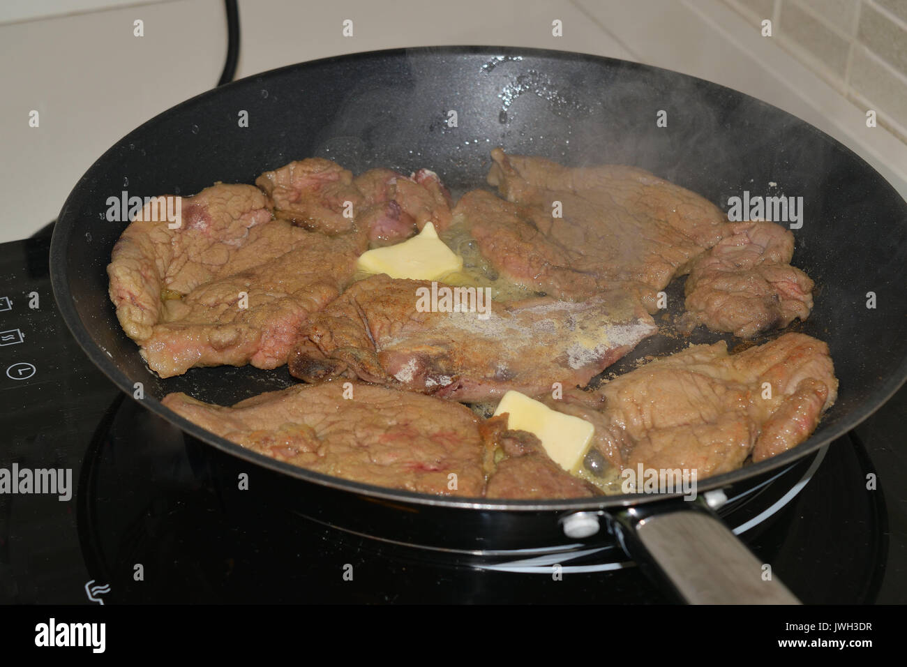 Induction pan hi-res stock photography and images - Alamy