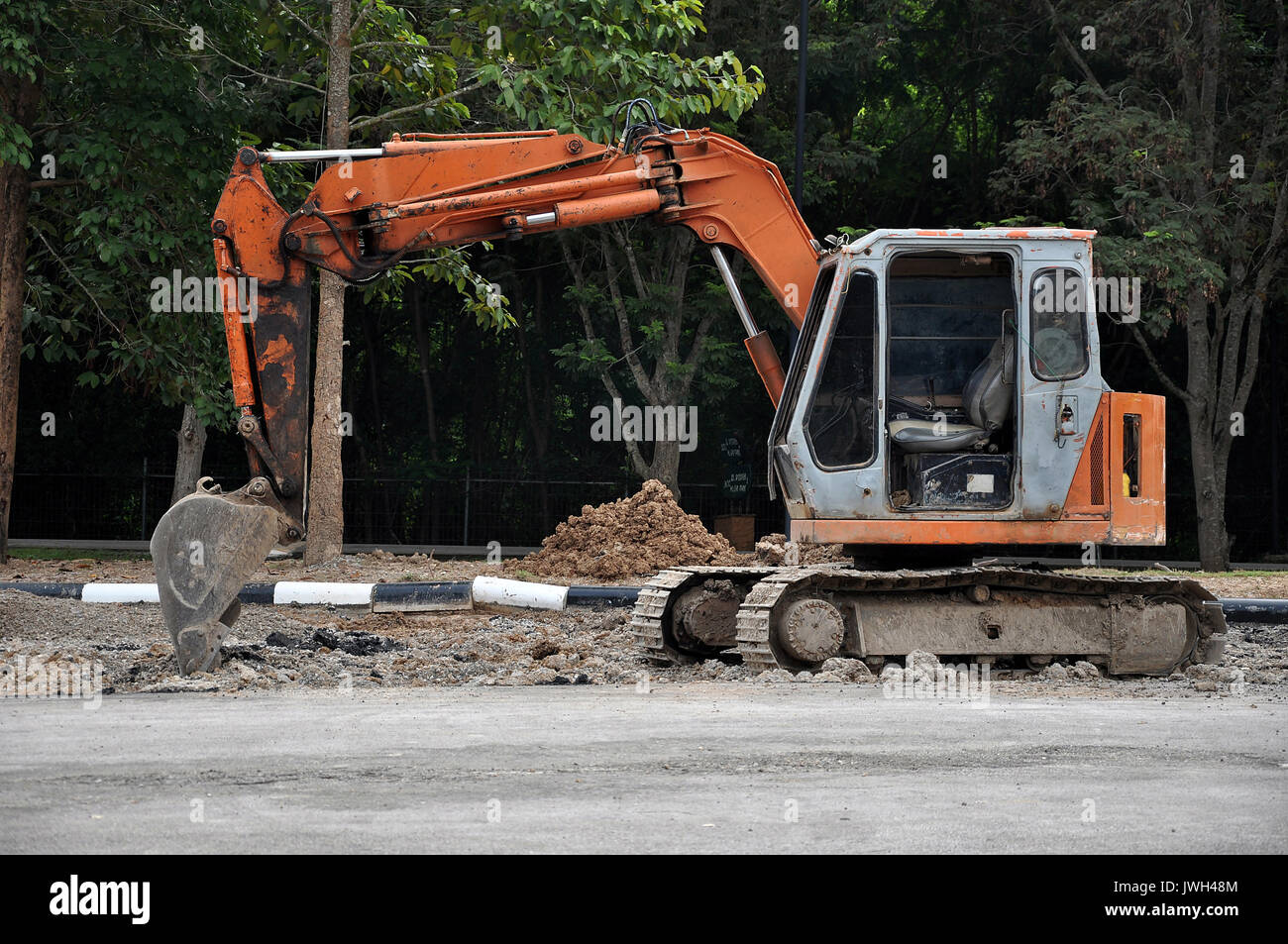 Excavators are heavy construction equipment consisting of a boom ...