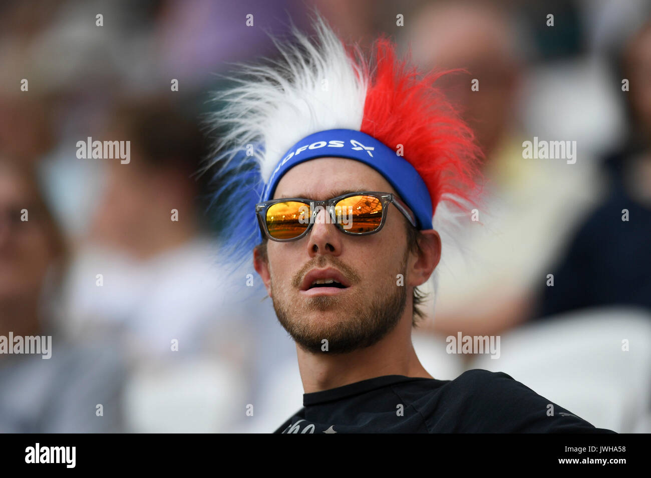 London, UK. 12 August 2017. A French fan watches the decathlon pole ...