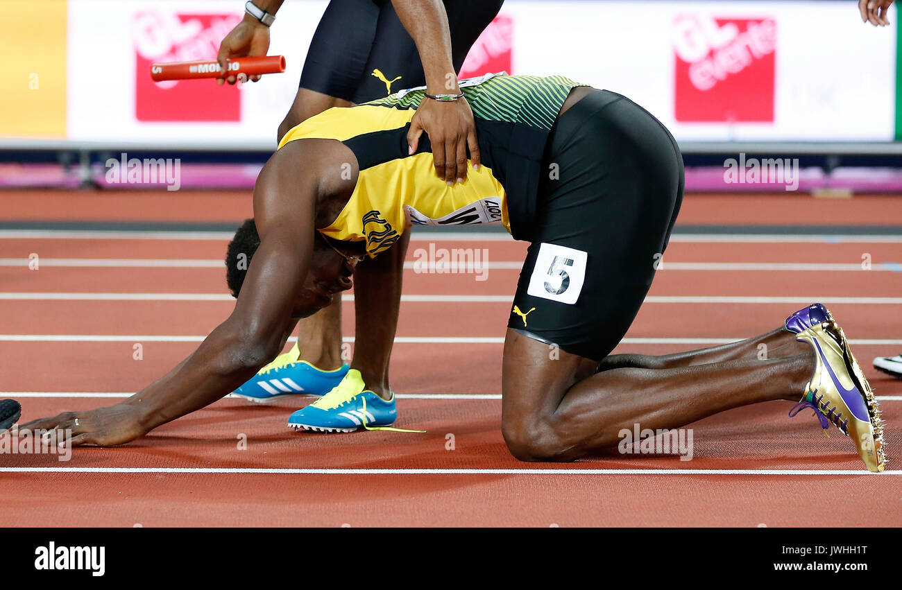 London, Britain. 12th Aug, 2017. Usain Bolt of Jamaica is helped by his ...