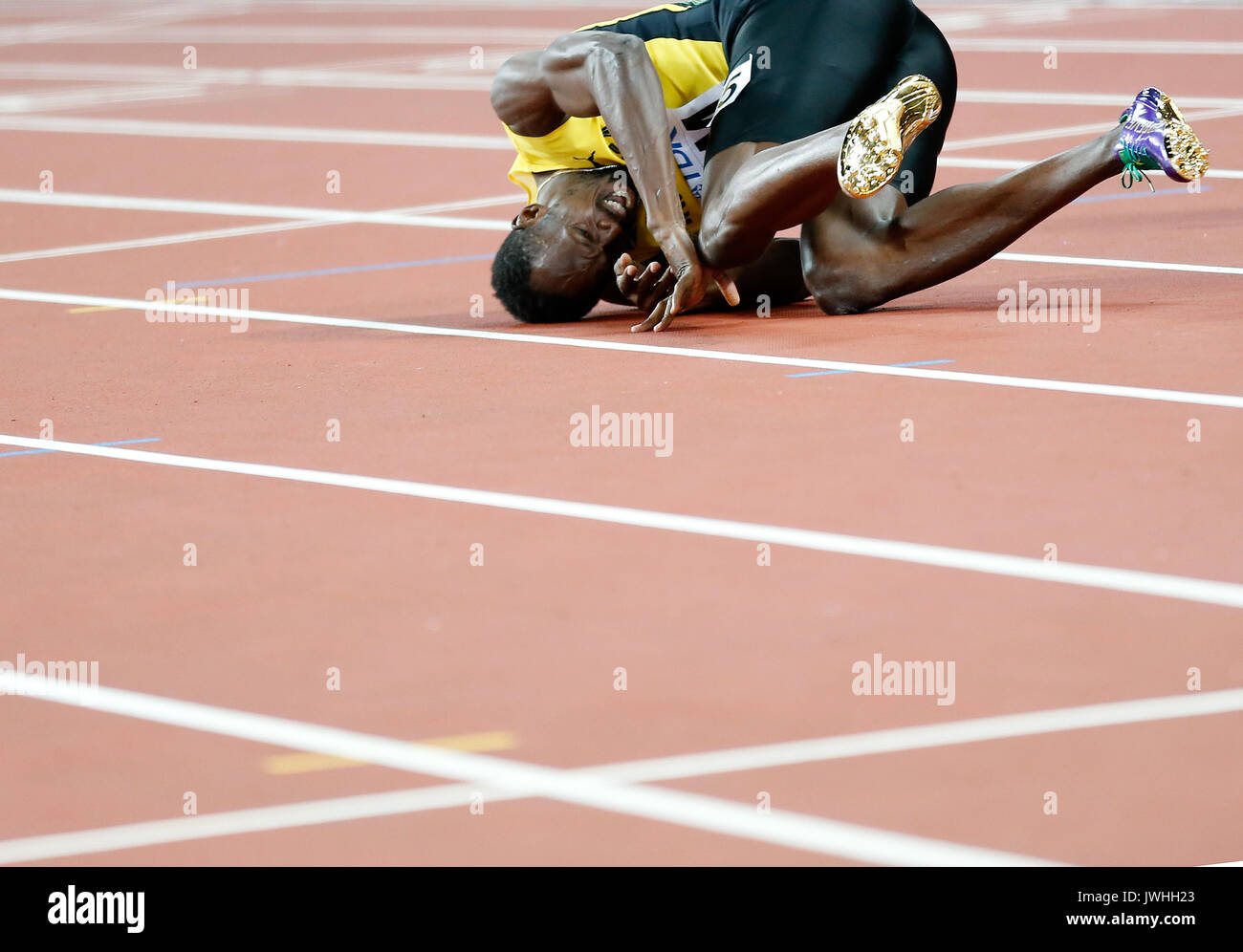 London, Britain. 12th Aug, 2017. Usain Bolt of Jamaica falls down as he ...