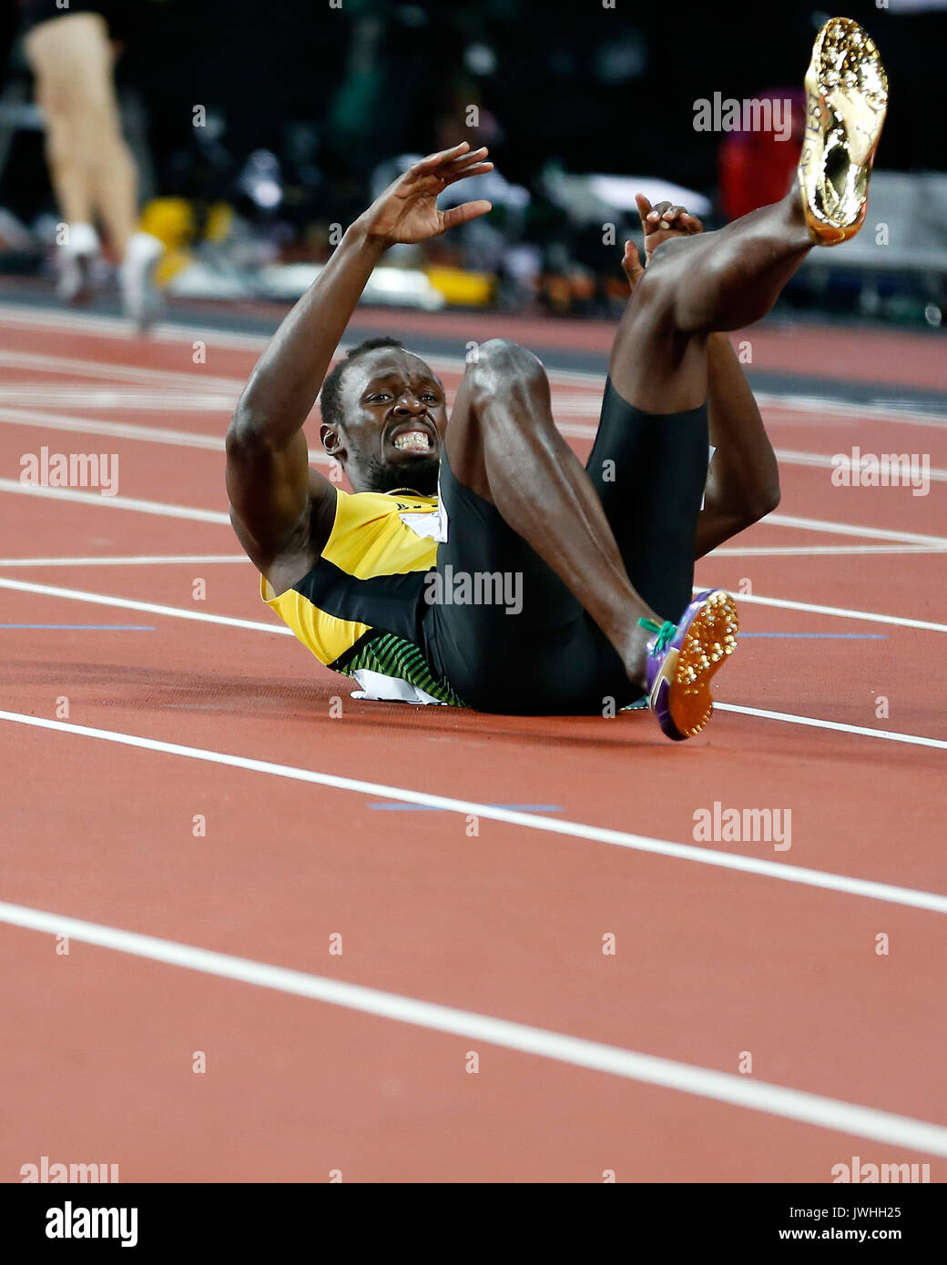 London, Britain. 12th Aug, 2017. Usain Bolt of Jamaica falls down as he ...