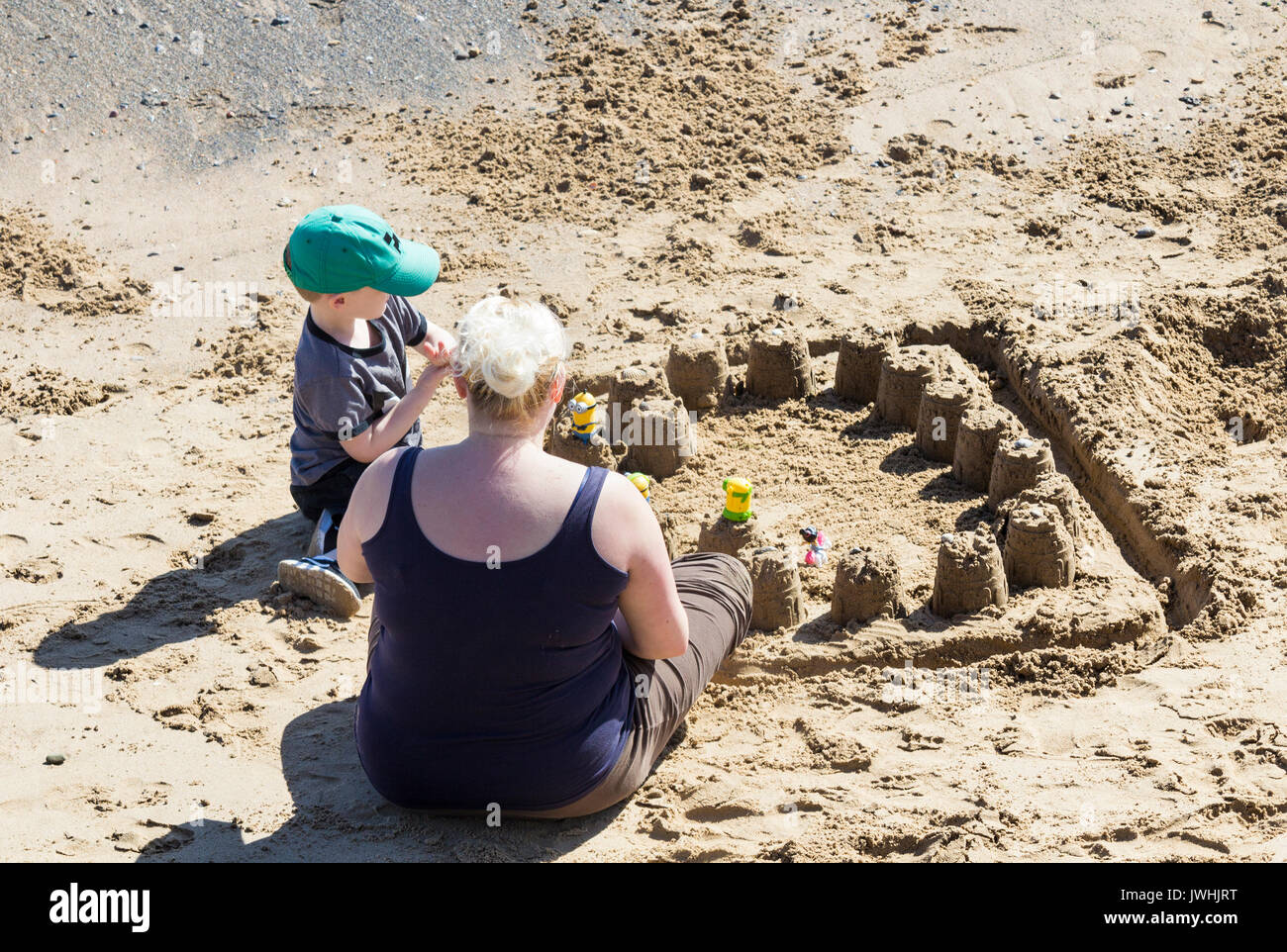 Young boy building Sandcastles on beach. UK Stock Photo - Alamy
