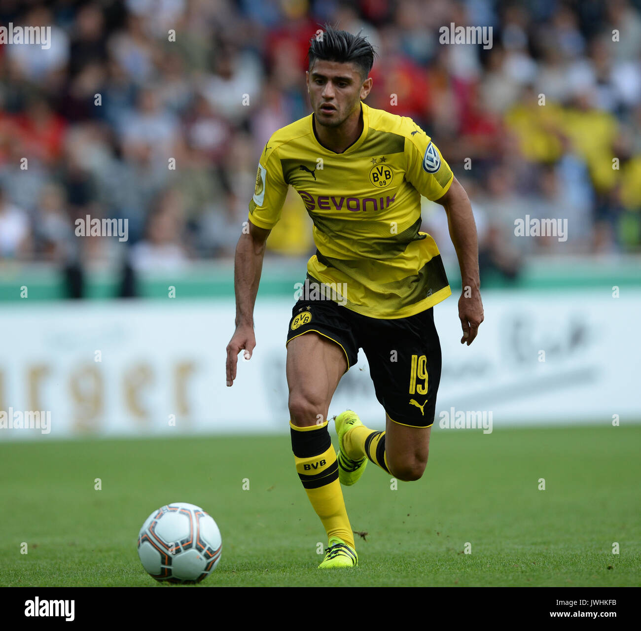 Freiburg, Germany. 12th Aug, 2017. Dortmund's Mahmoud Dahoud runs with ...