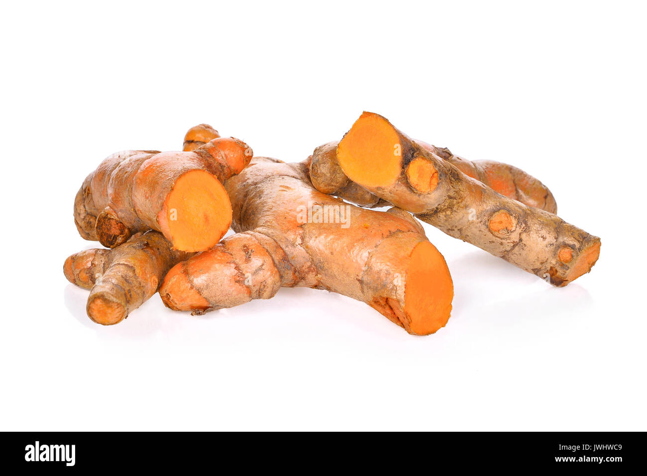 turmeric root isolated on white background Stock Photo - Alamy