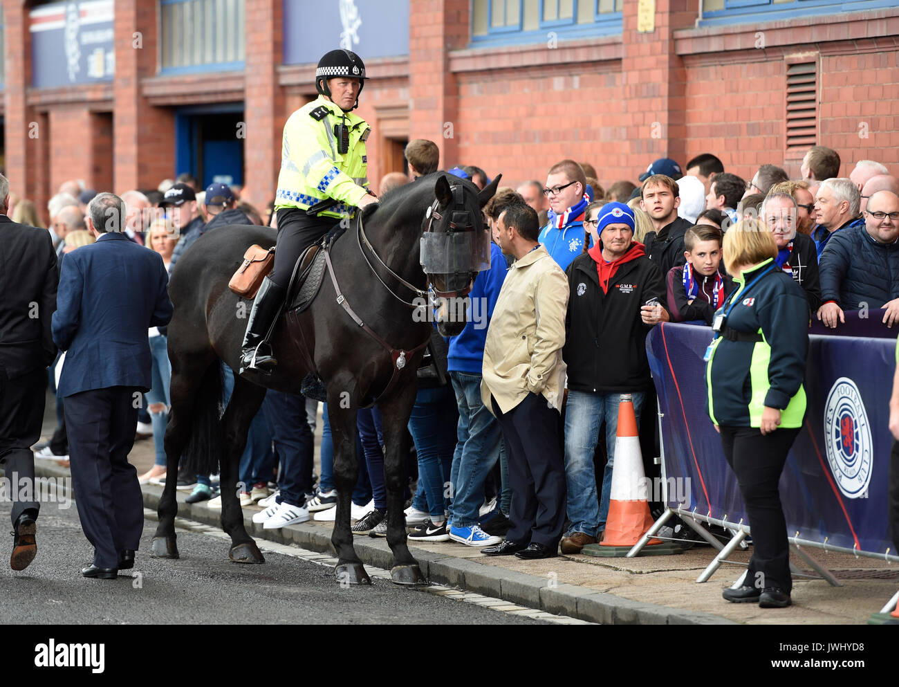 Rangers fans watch as the Hibs team bus arrives before the Betfred Cup ...