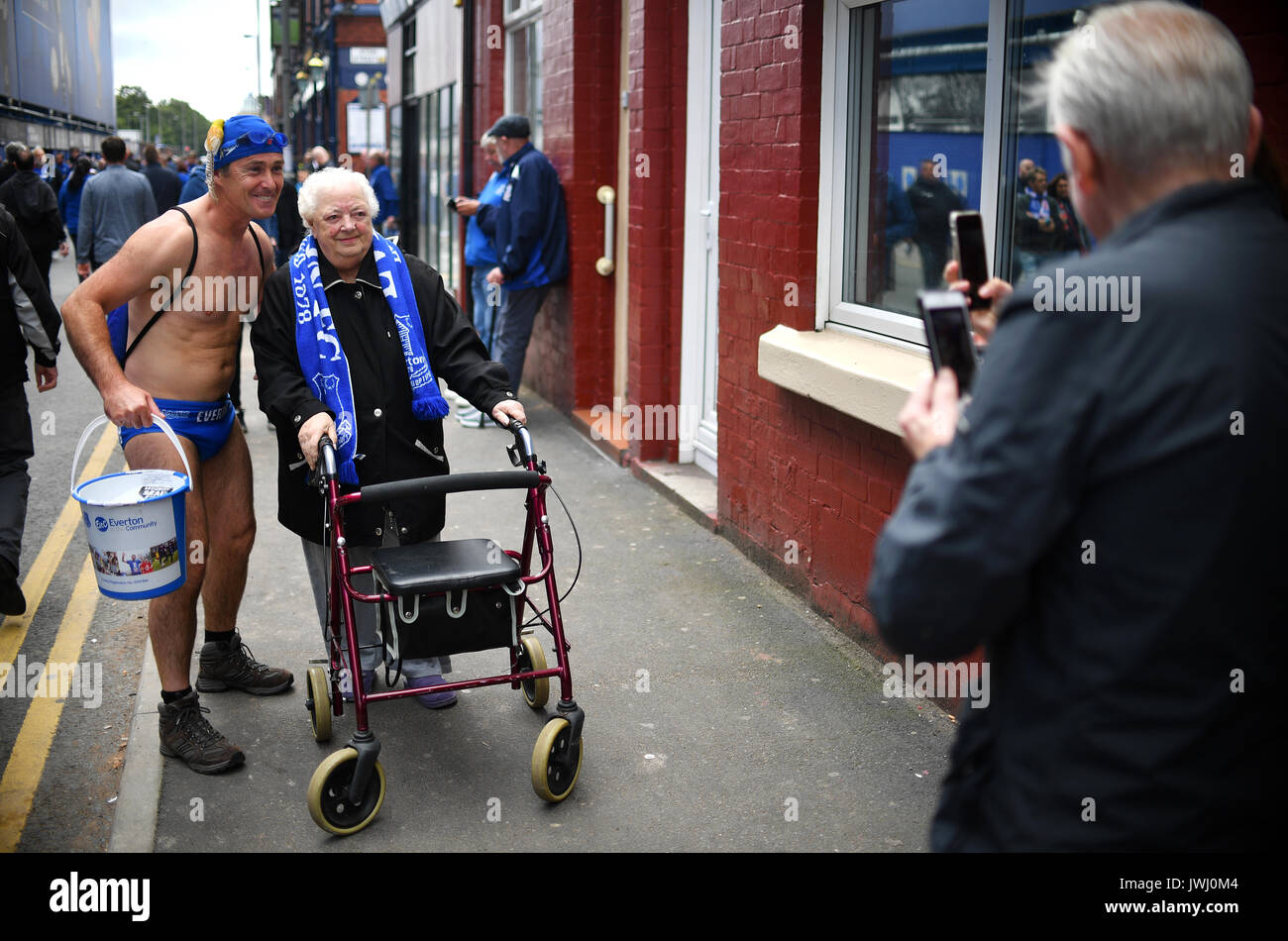 Everton fan, 'Speedo Mick' poses with another fan outside the ground ...